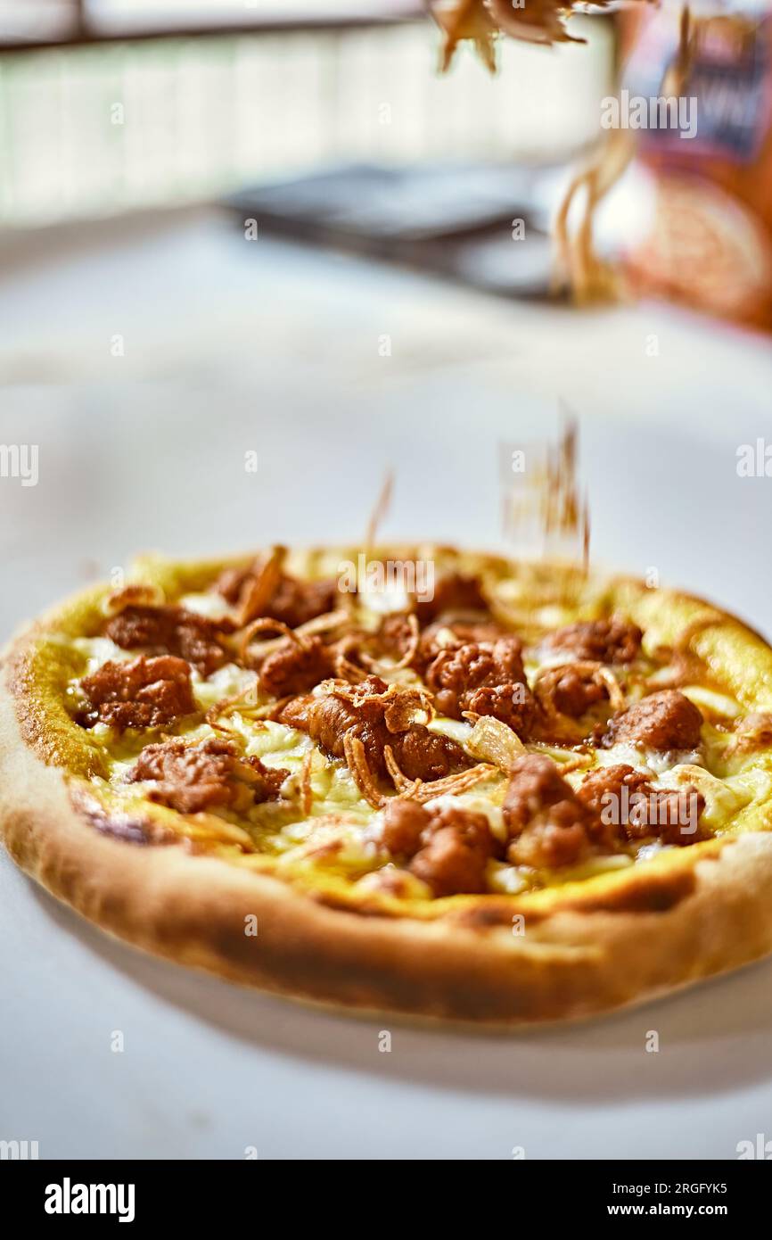 Grilled Chicken Pizza with Red Onion and Cilantro Stock Photo - Alamy