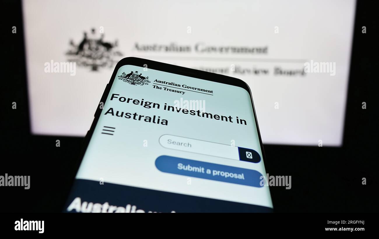 Mobile phone with website of Australian Foreign Investment Review Board ...