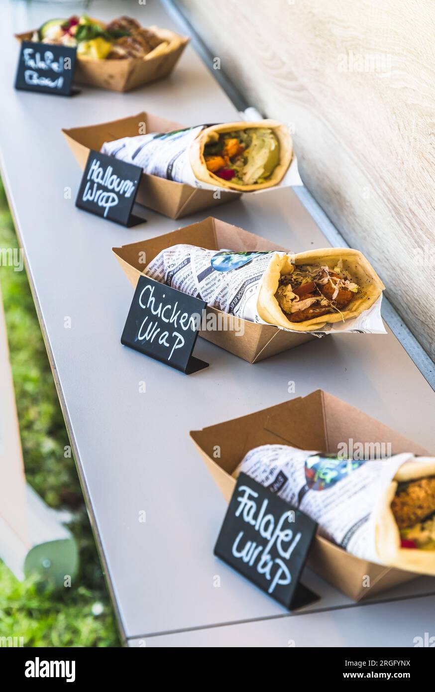 Assorted wraps with price tag on a food truck at the festival Stock ...