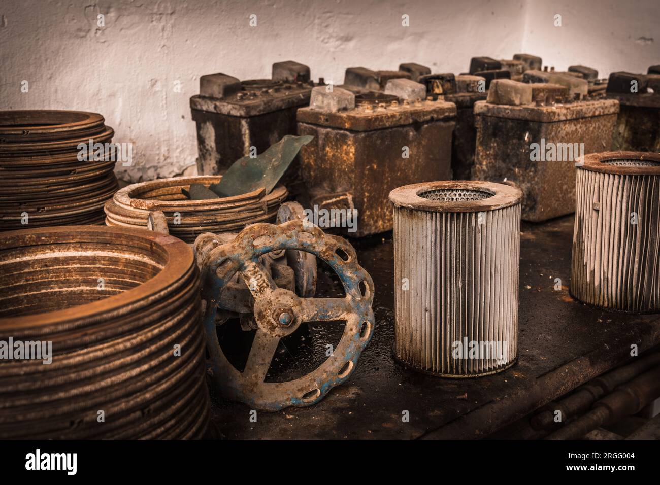 Very old rusty machine accessories on a shelf Stock Photo - Alamy