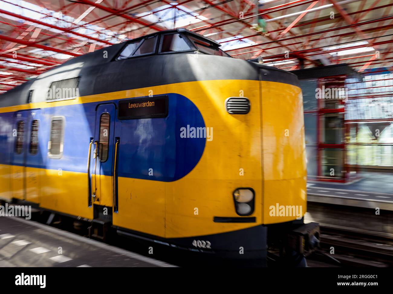 ALMERE - A train at Almere Centrum station. Traveler organization Rover ...