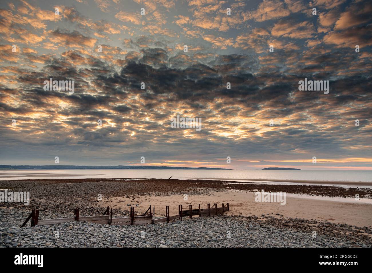 Sunset over Llanfairfechan beach on the North Wales coast Stock Photo ...