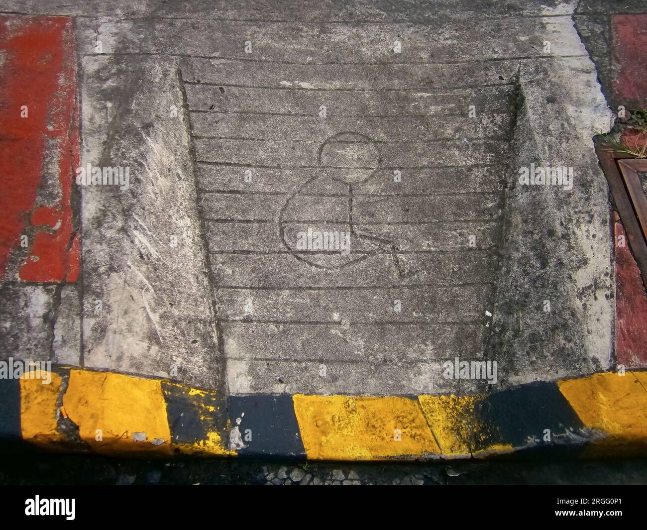Close-up of a disabled logo on an inclined pavement in the city Stock ...