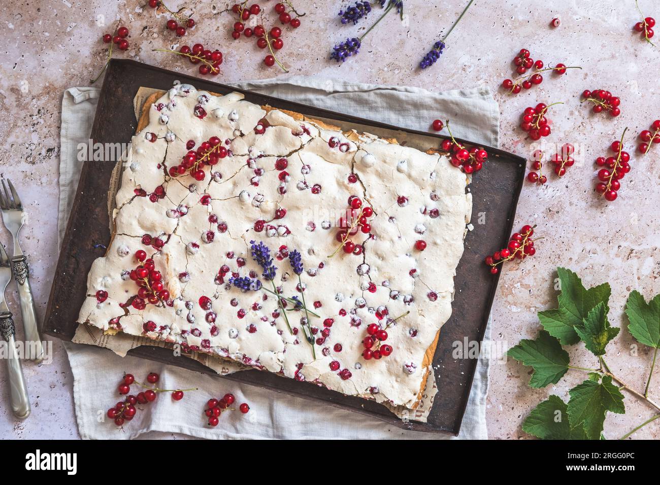 Whole currant cake with crispy meringue on top and fresh fruits as ...