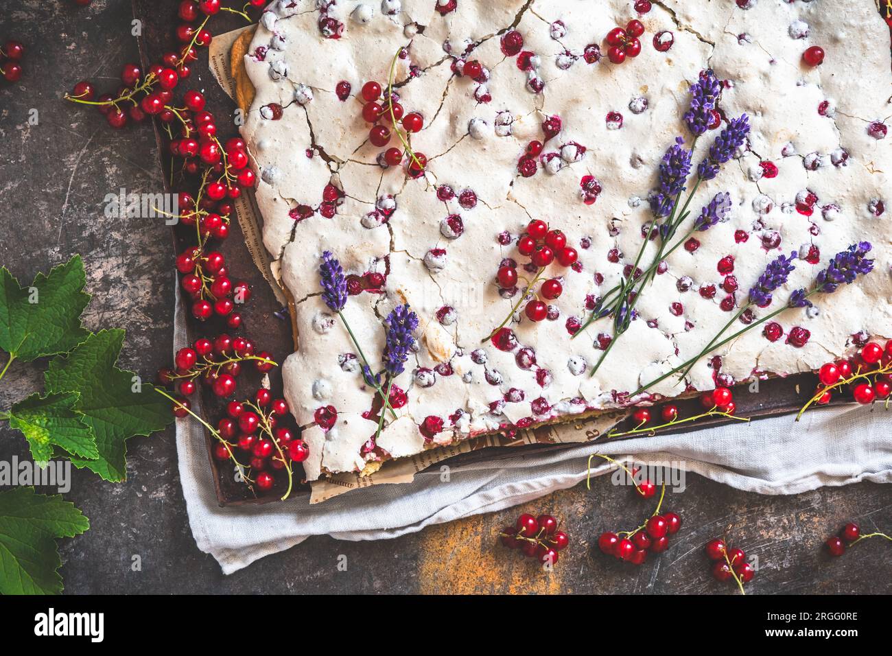 Whole currant cake with crispy meringue on top and fresh fruits as ...