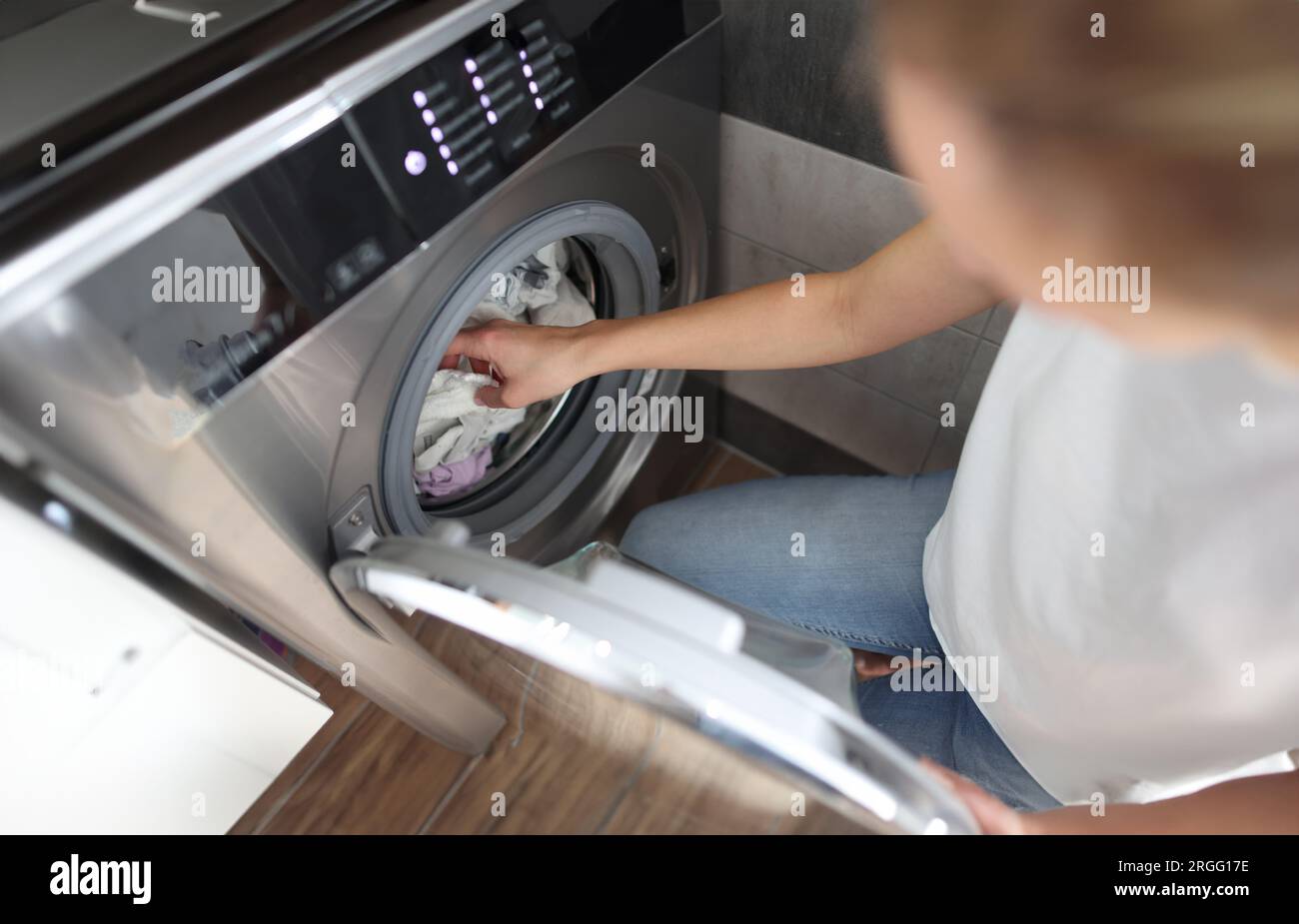 Washing machine is loaded with laundry for washing Stock Photo - Alamy
