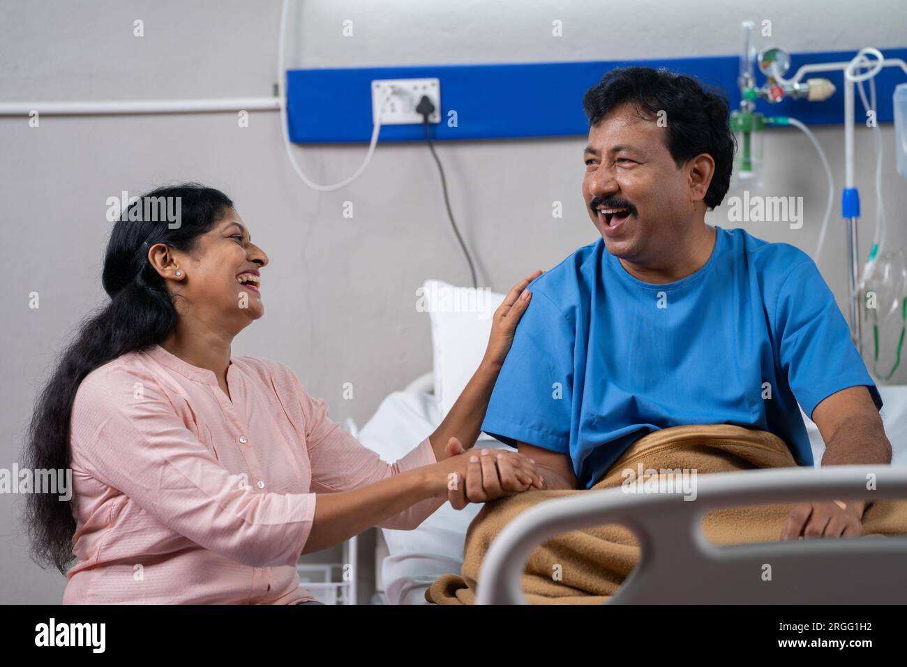 Happy Person In Hospital Bed