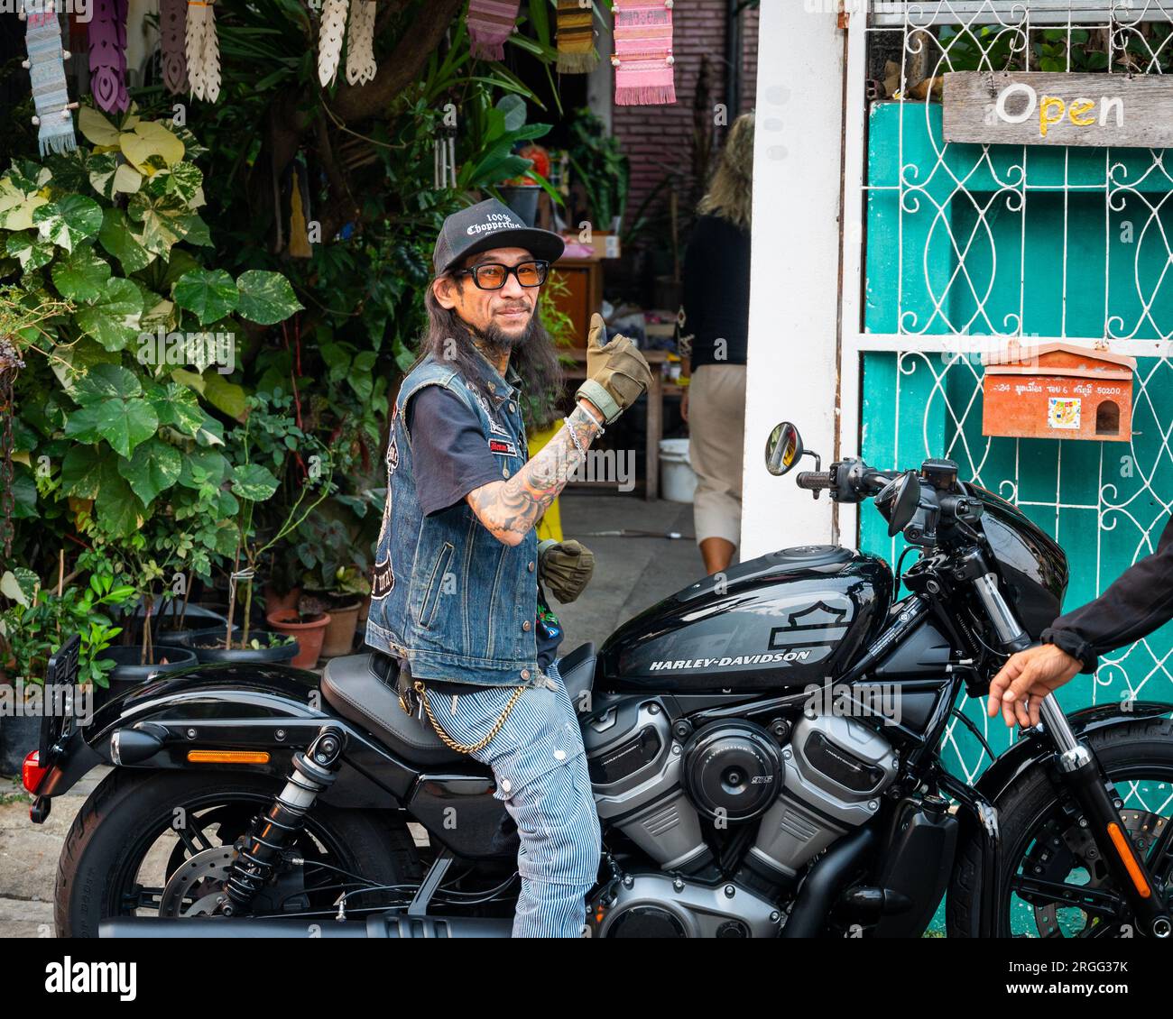 Thai biker smoking weed in Chiang Mai Stock Photo - Alamy