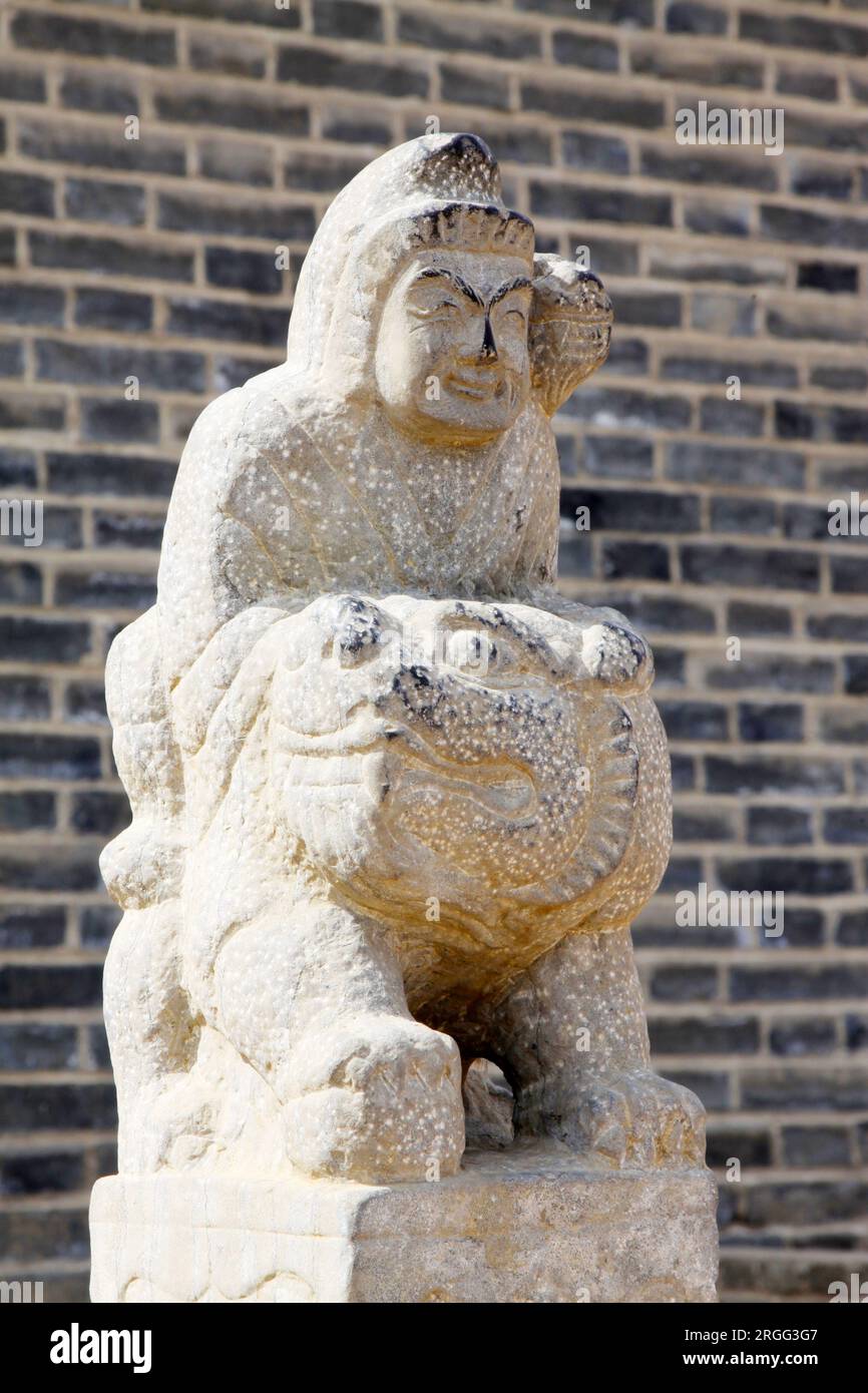Ancient Chinese traditional stone carving in a scenic spot, in ...