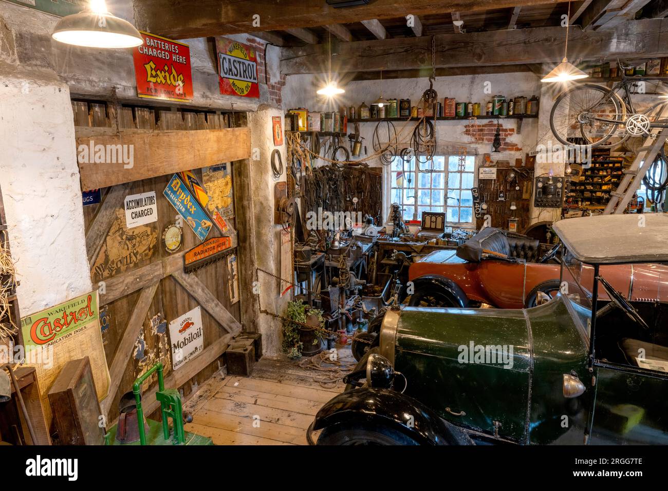 Display of motoring objects shown in a garage of the 1930's at the ...
