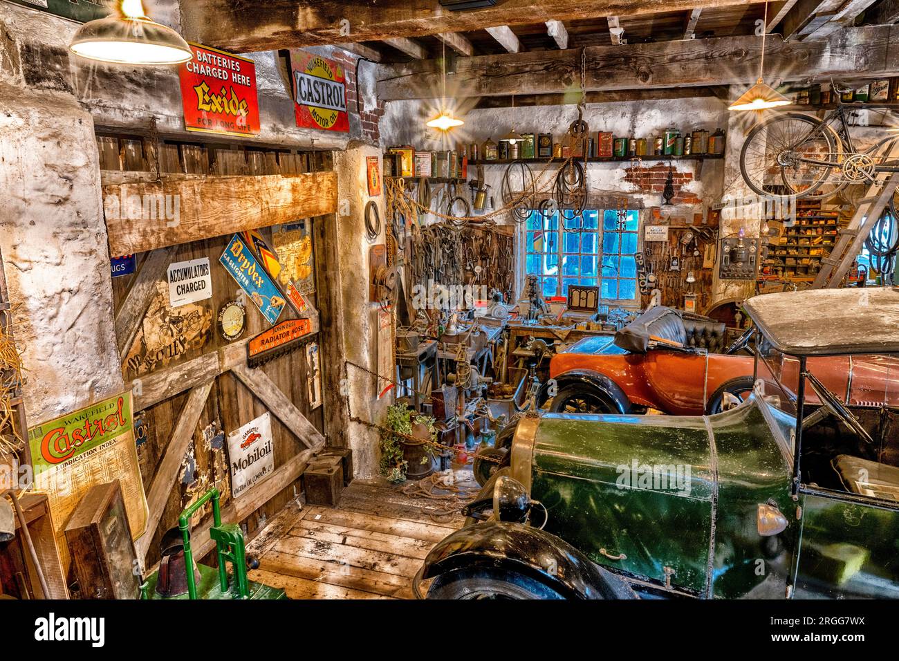 Display of motoring objects shown in a garage of the 1930's at the ...
