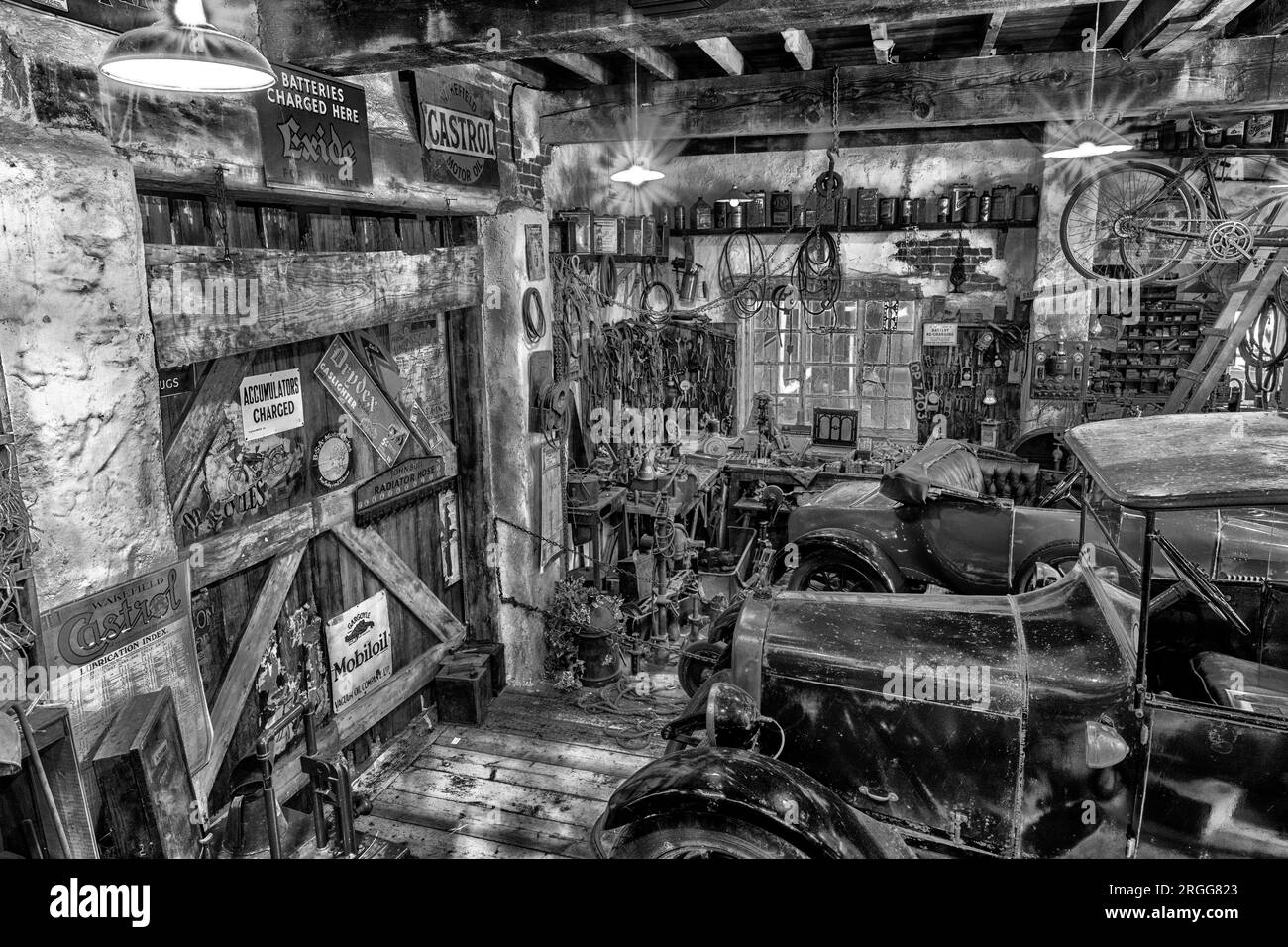 Display of motoring objects shown in a garage of the 1930's at the ...