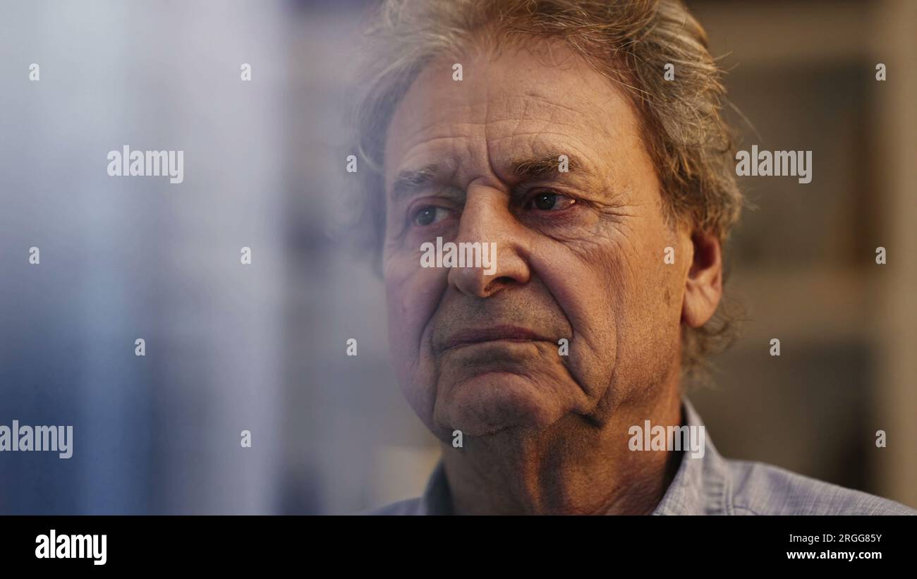 One serious contemplative senior man thinking about life seen through ...