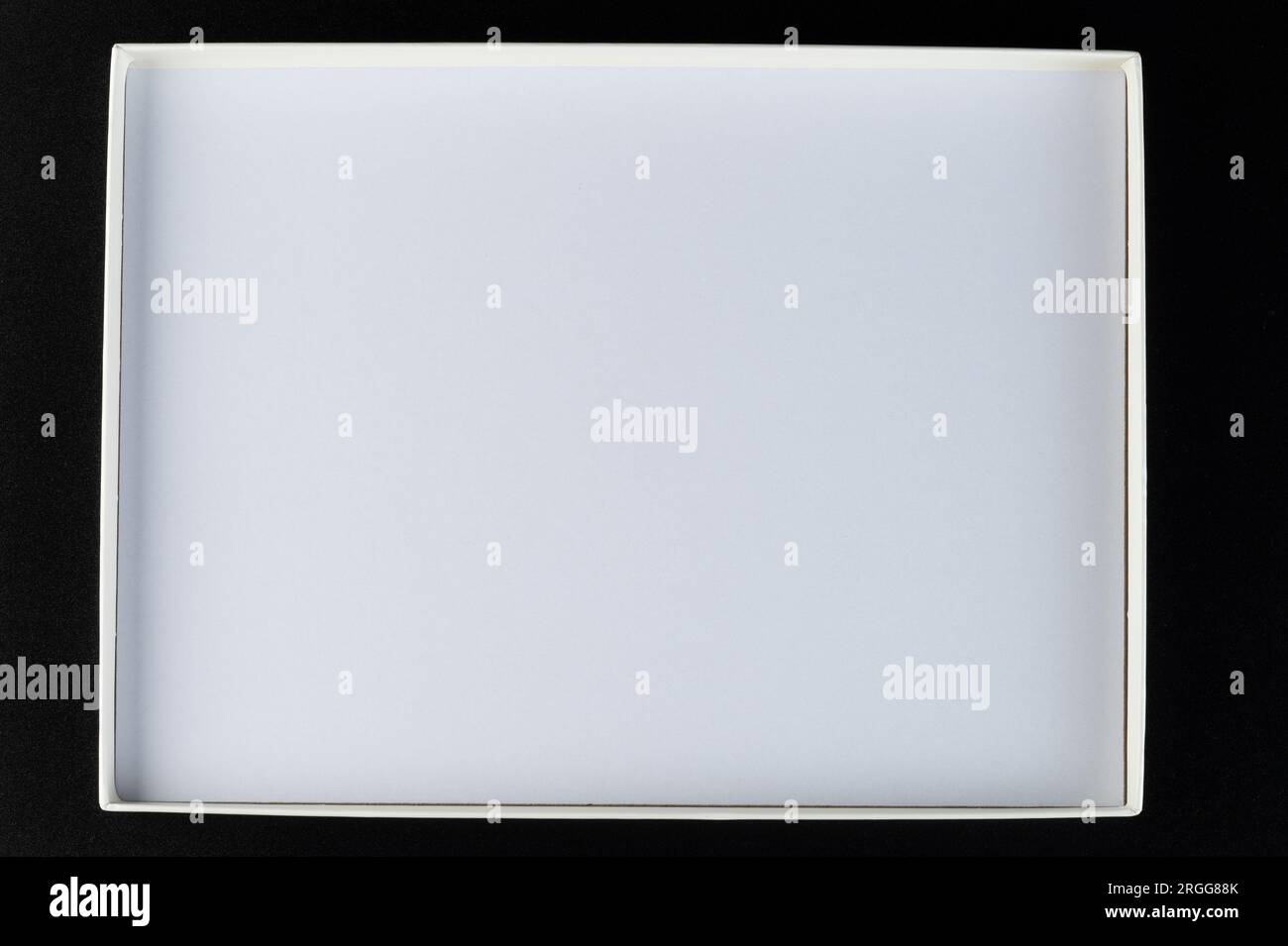 Open white paper box cover with shade above top view Stock Photo - Alamy