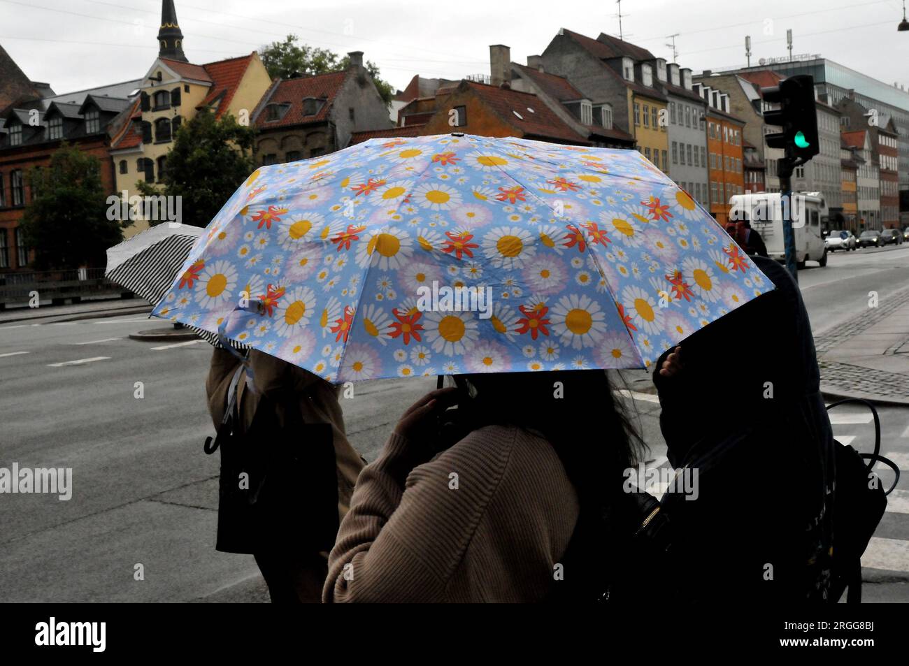 Copenhagen/Denmark/09 August 2023/Weather rain fall and people use ...