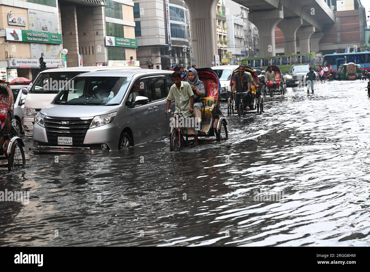 Dhaka, Bangladesh. 09th Aug, 2023. Vehicles try driving and citizens ...