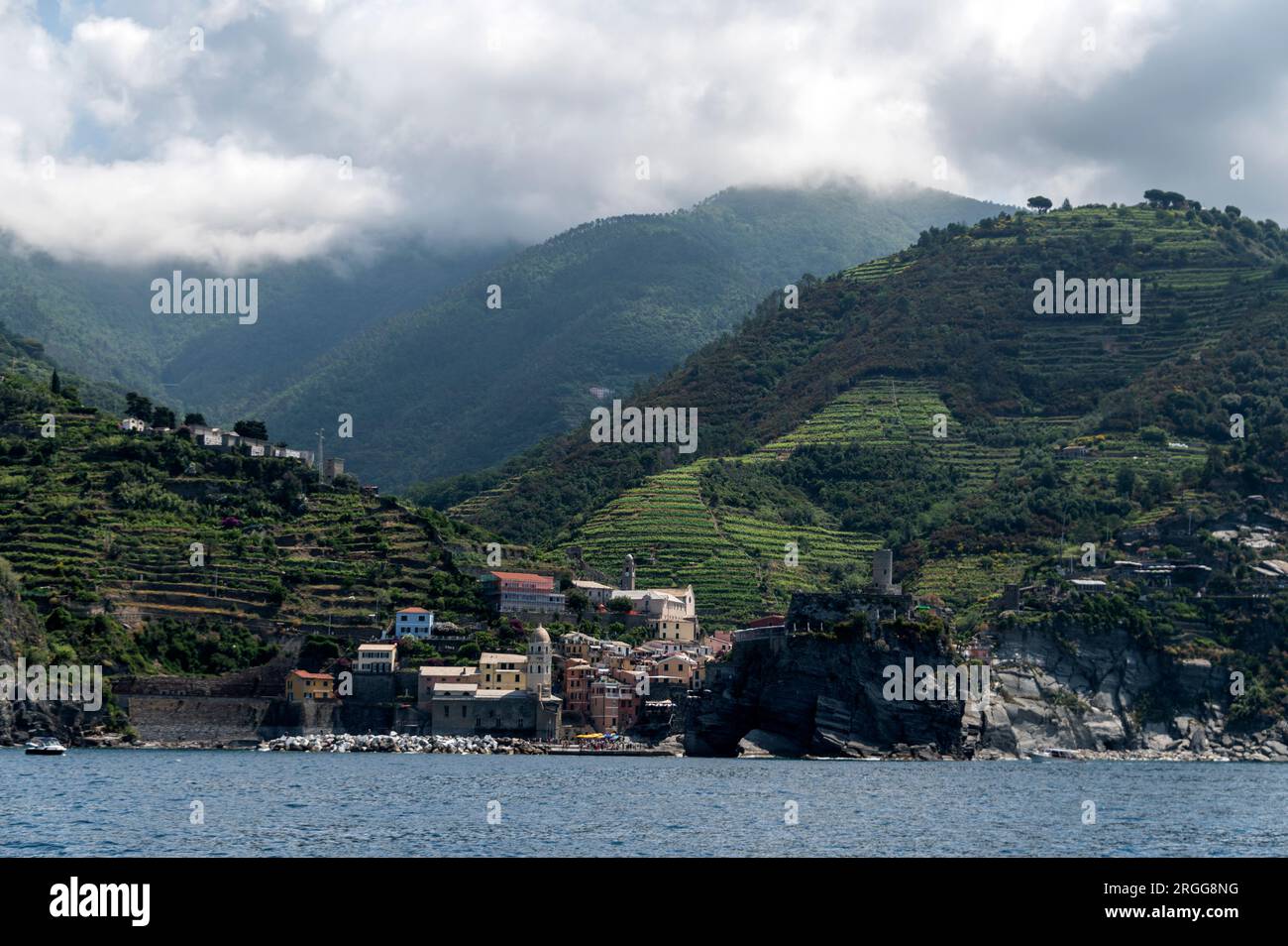The seafront of Vernazza and the Doria Castle on top of a rock is one ...