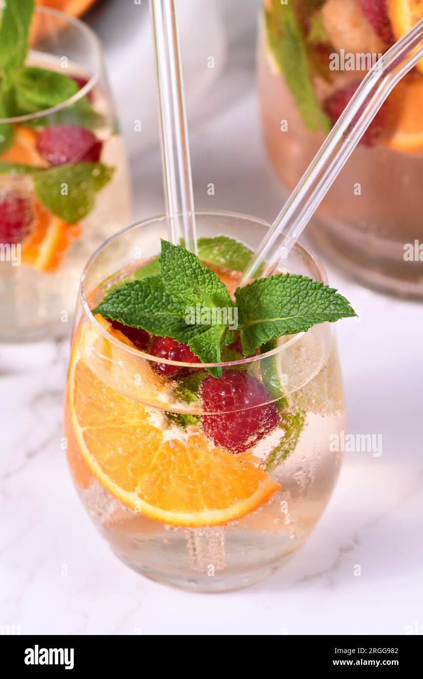 Summer Sangria cocktail or lemonade with raspberry, orange and mint ...