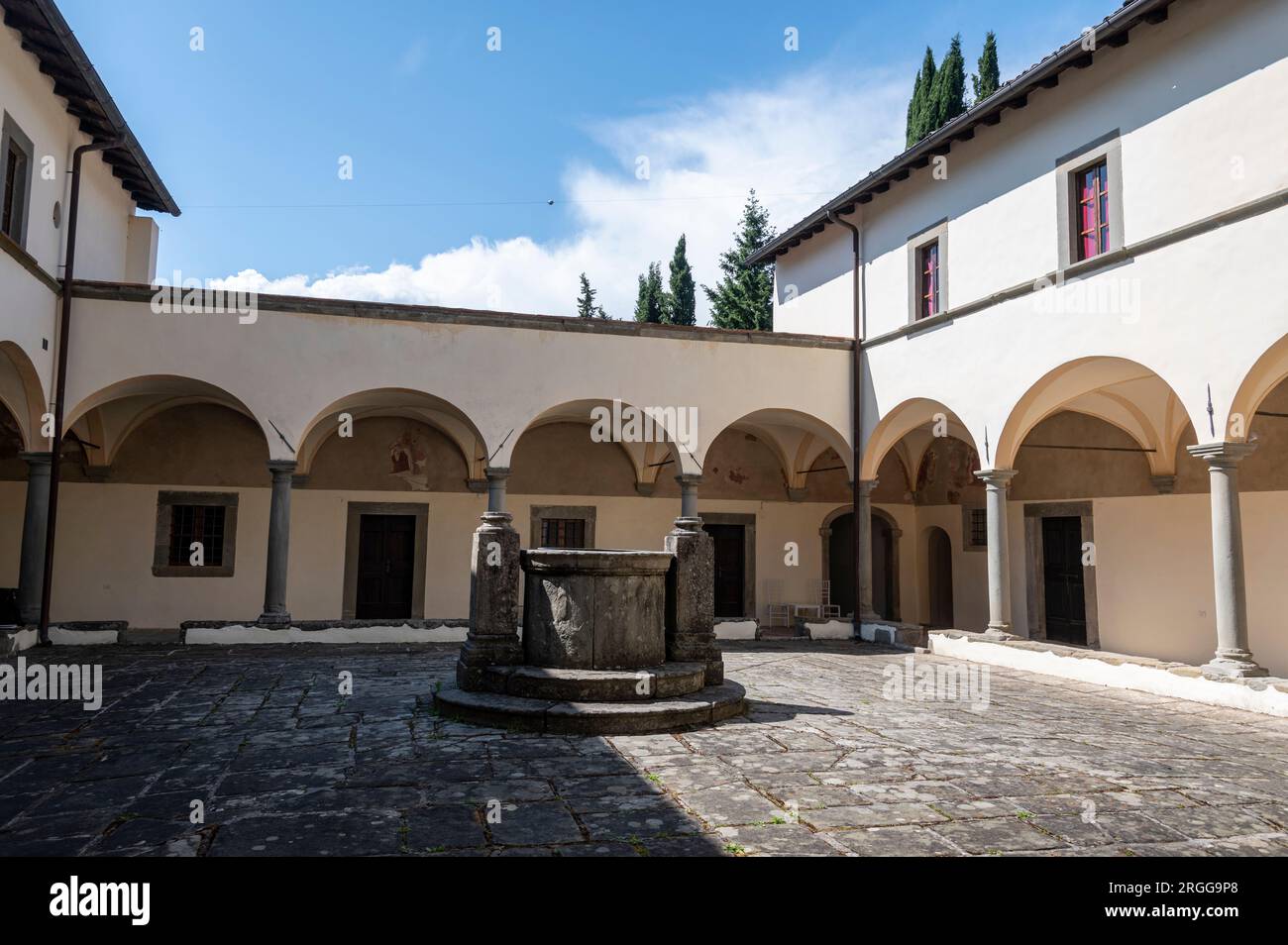 The surrounding cloisters with fading murals painted by local artist ...