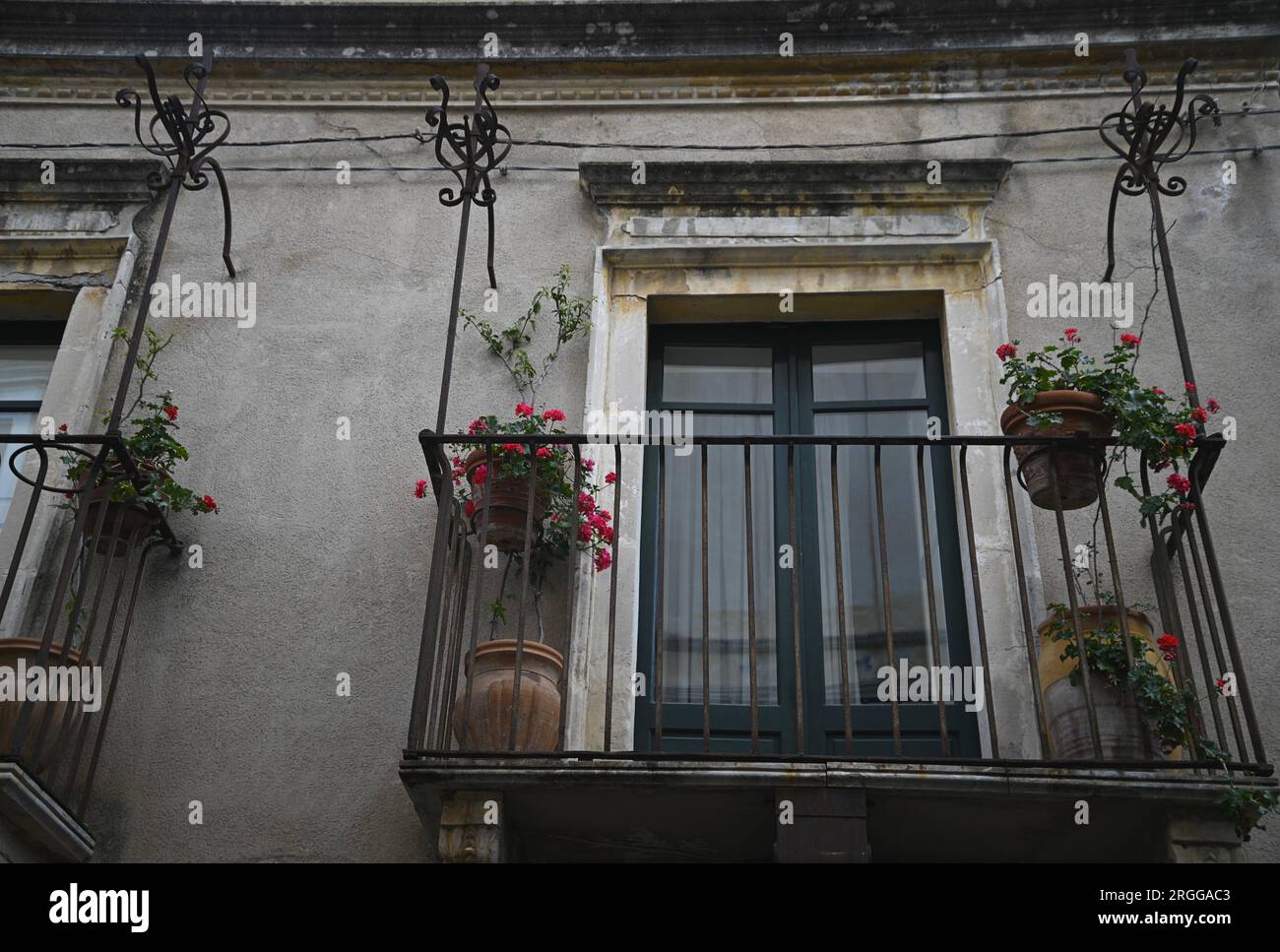 Old Neoclassical house balcony in Taormina Sicily, Italy Stock Photo ...