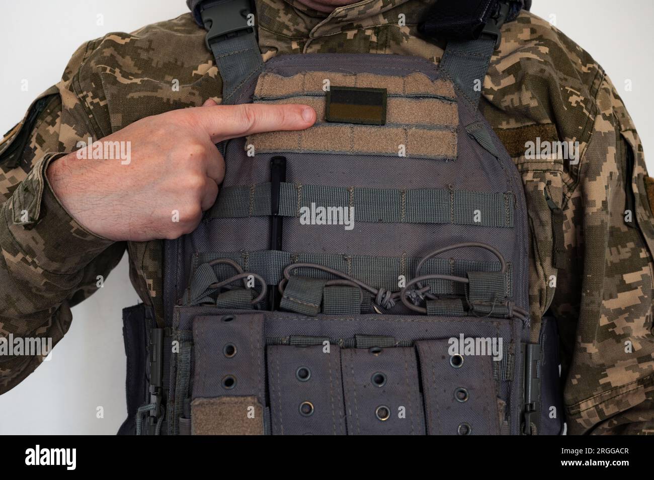 Ukrainian soldier in military pixel unform and bulletproof vest jacket ...