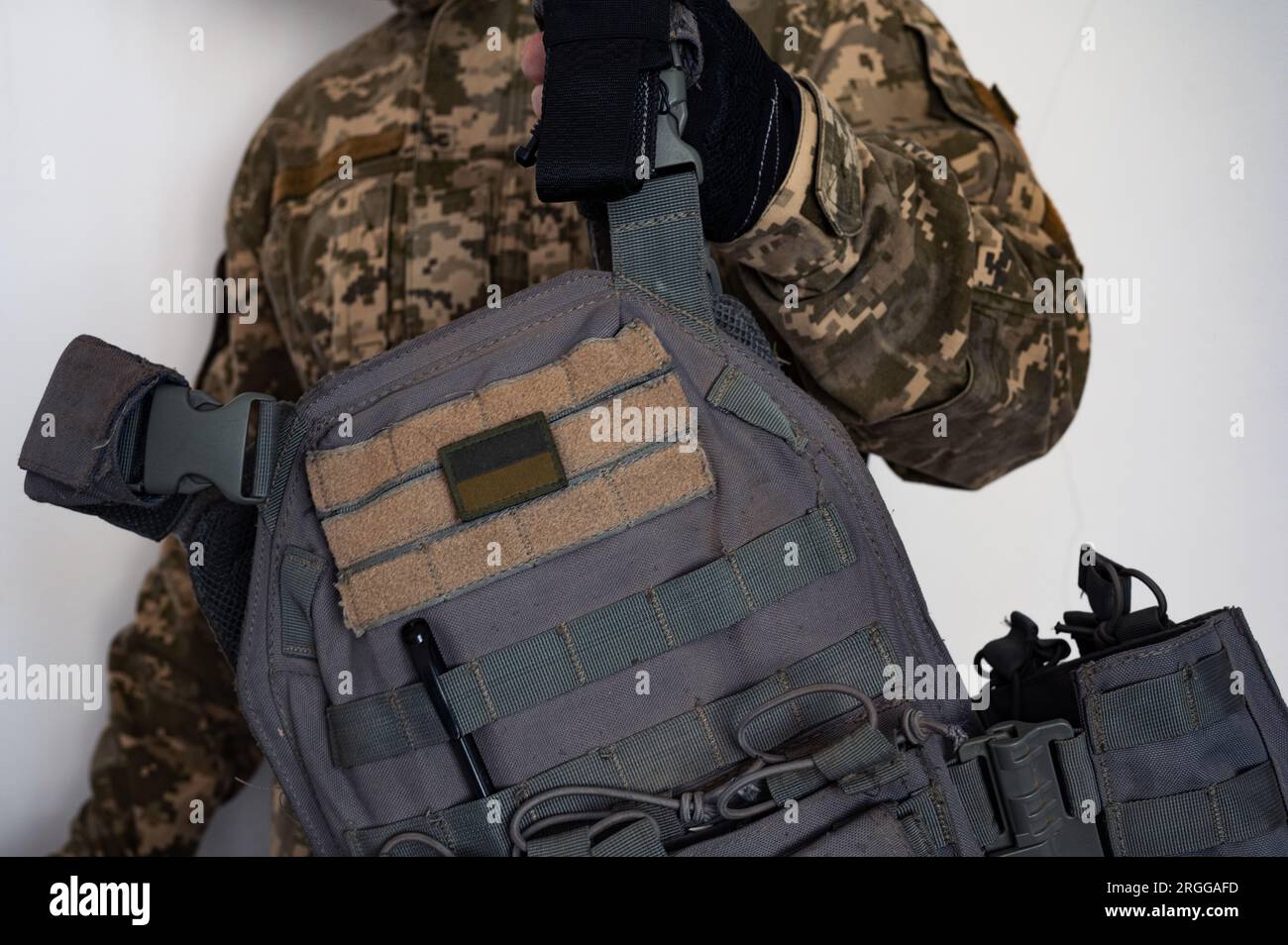 Ukrainian soldier in military pixel unform camouflage with grey ...