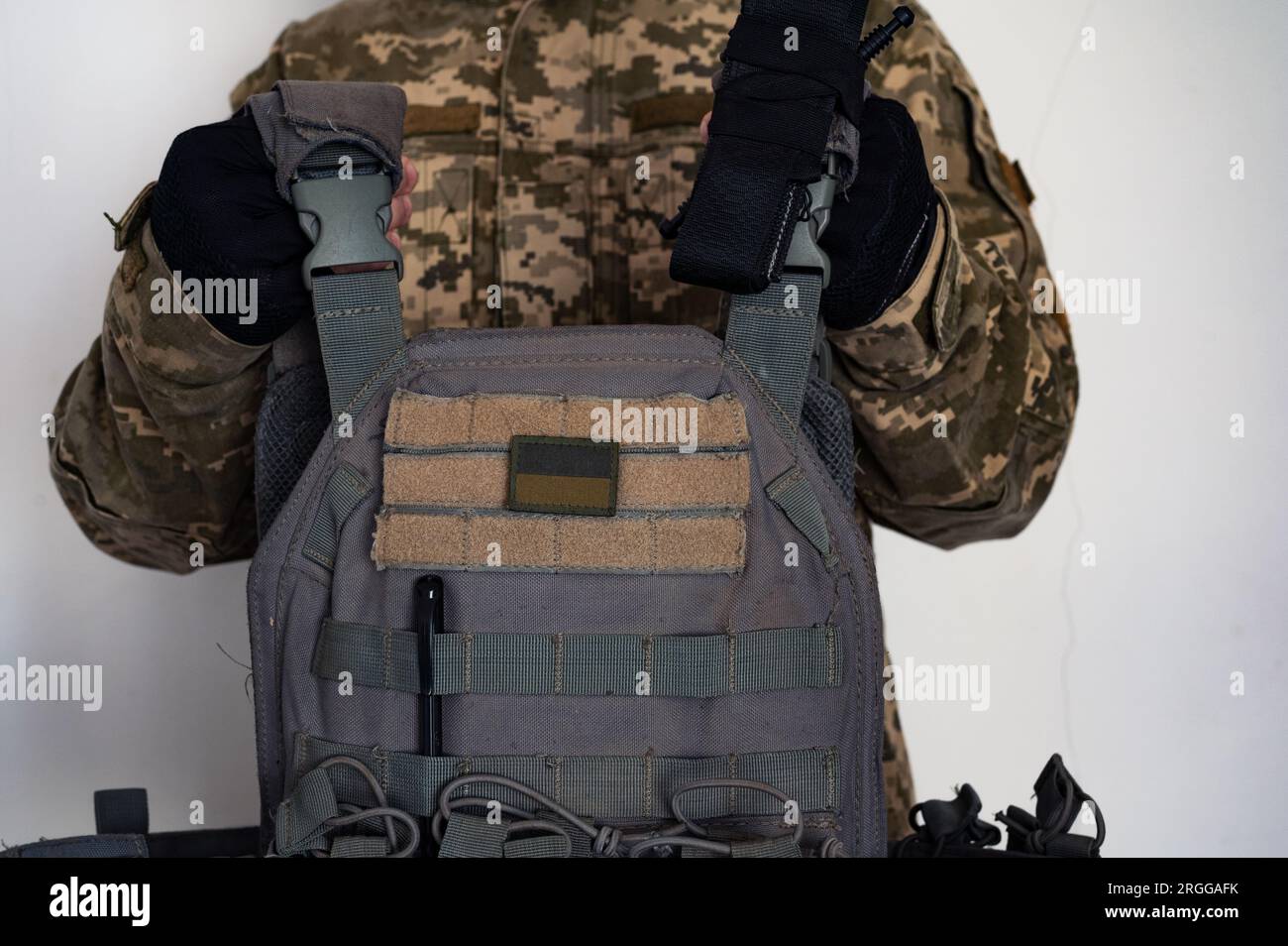 Ukrainian soldier in military pixel unform camouflage with grey ...