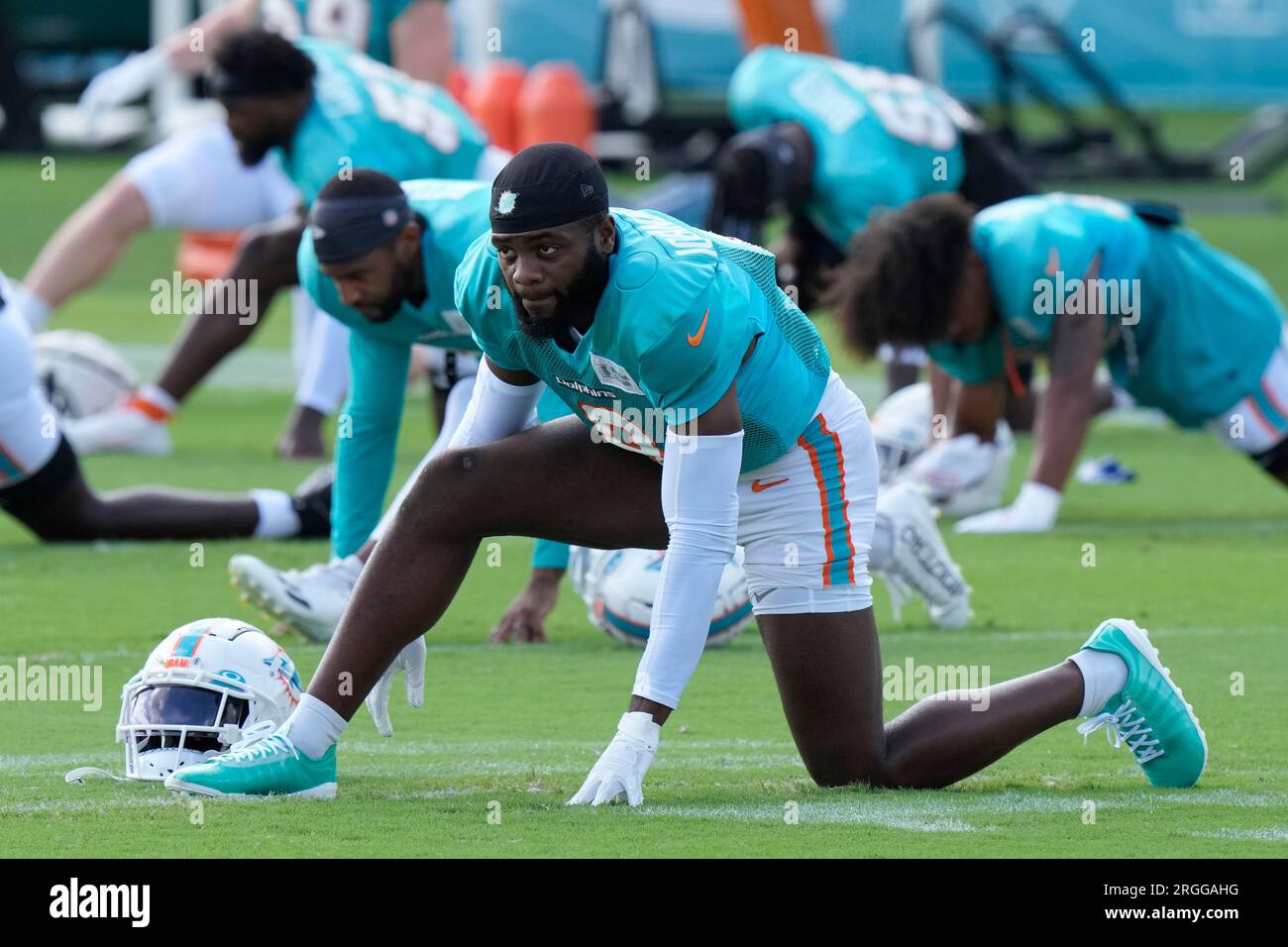 Miami Dolphins cornerback Noah Igbinoghene stretches out during a joint practice with the ...