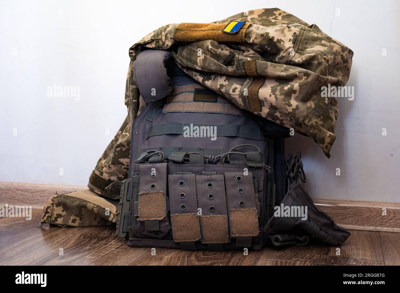 Mil grey bulletproof vest with banner of ukrainian flag and pixel ...