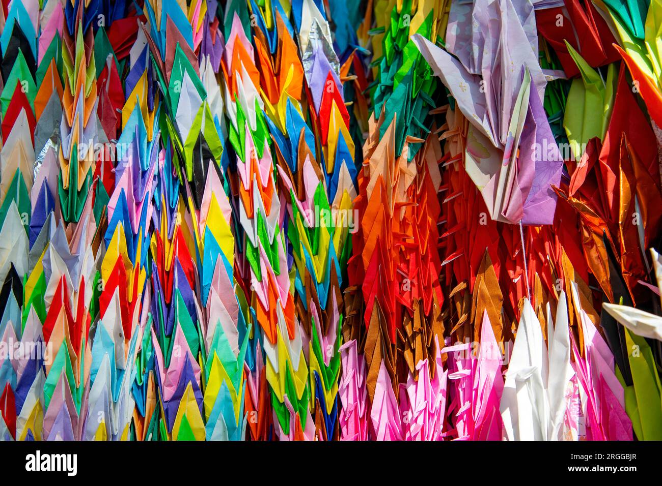 Image filling close up view of colorful Origami paper crane birds, a ...