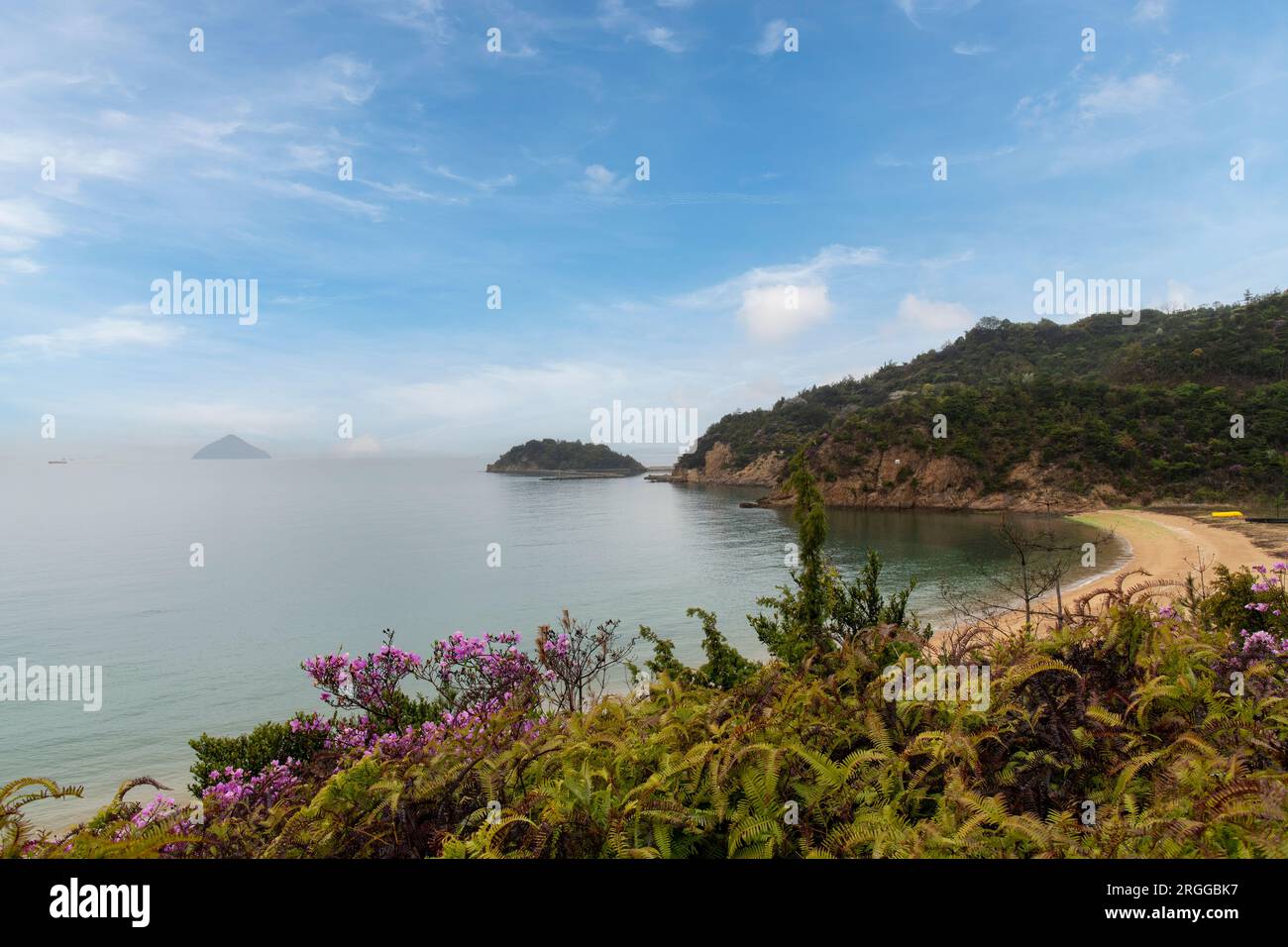 Panoramic view over the coastline with beach of Naoshima island in the ...