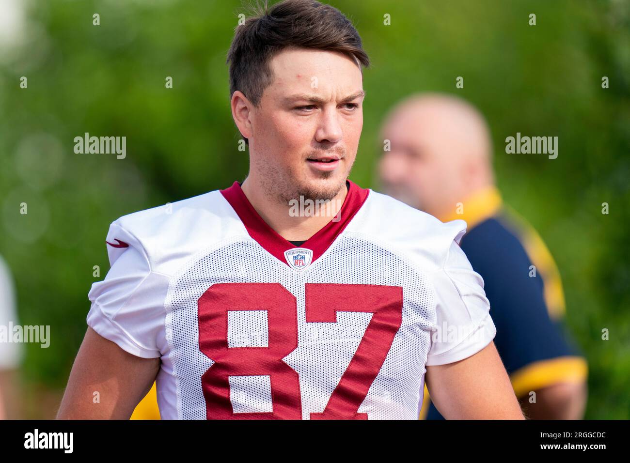 Washington Commanders tight end John Bates approaches the field before ...