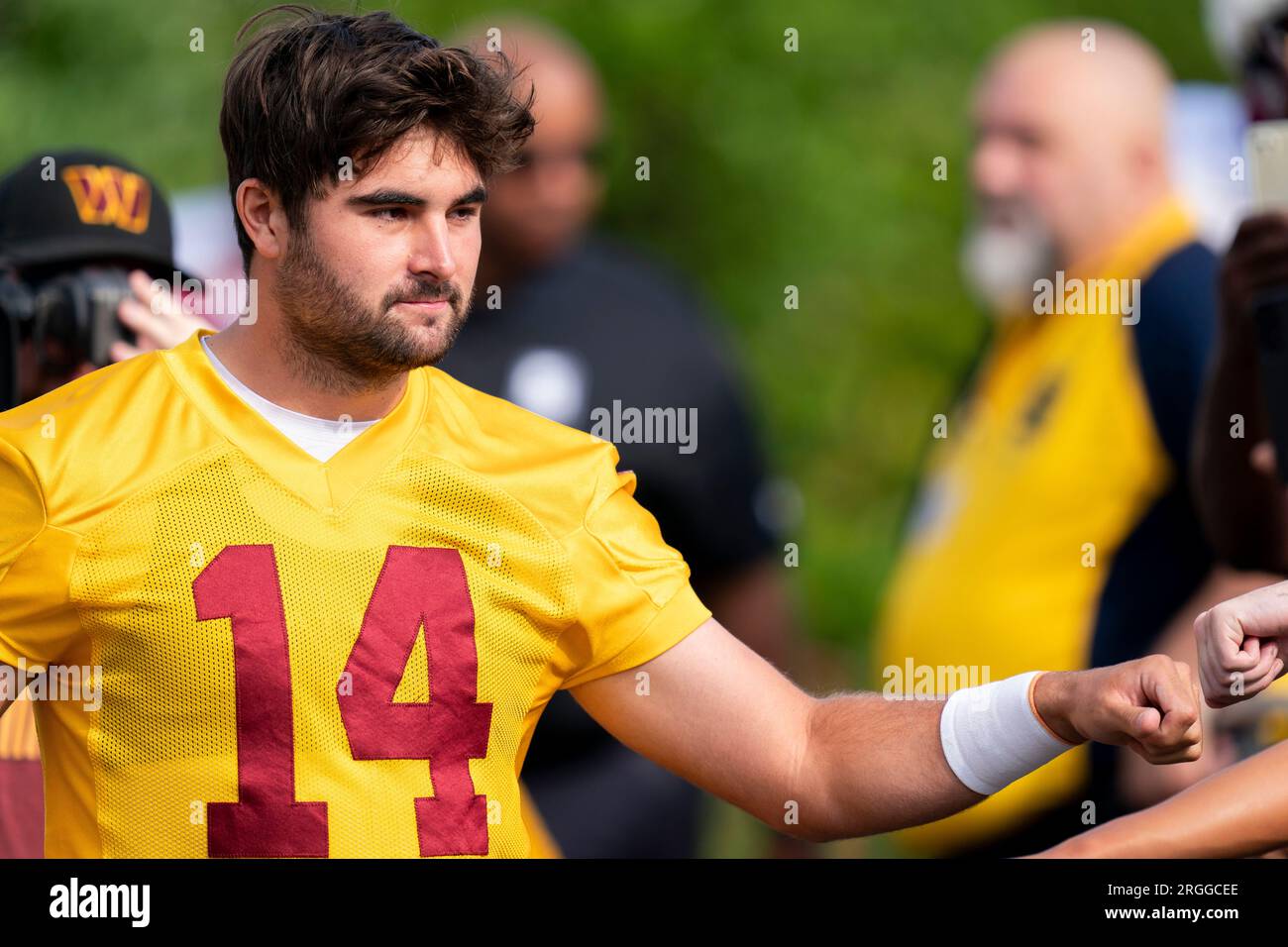 Washington Commanders quarterback Sam Howell approaches the field ...