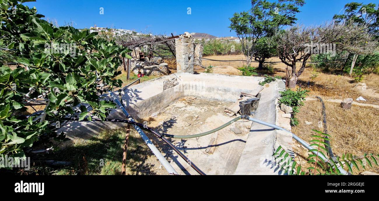 Water management, empty rain water reservoir, Syros island, Greece ...