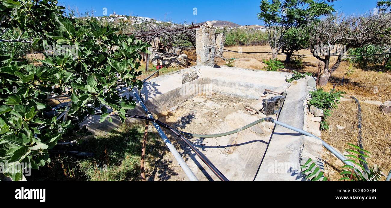 Water management, empty rain water reservoir, Syros island, Greece ...