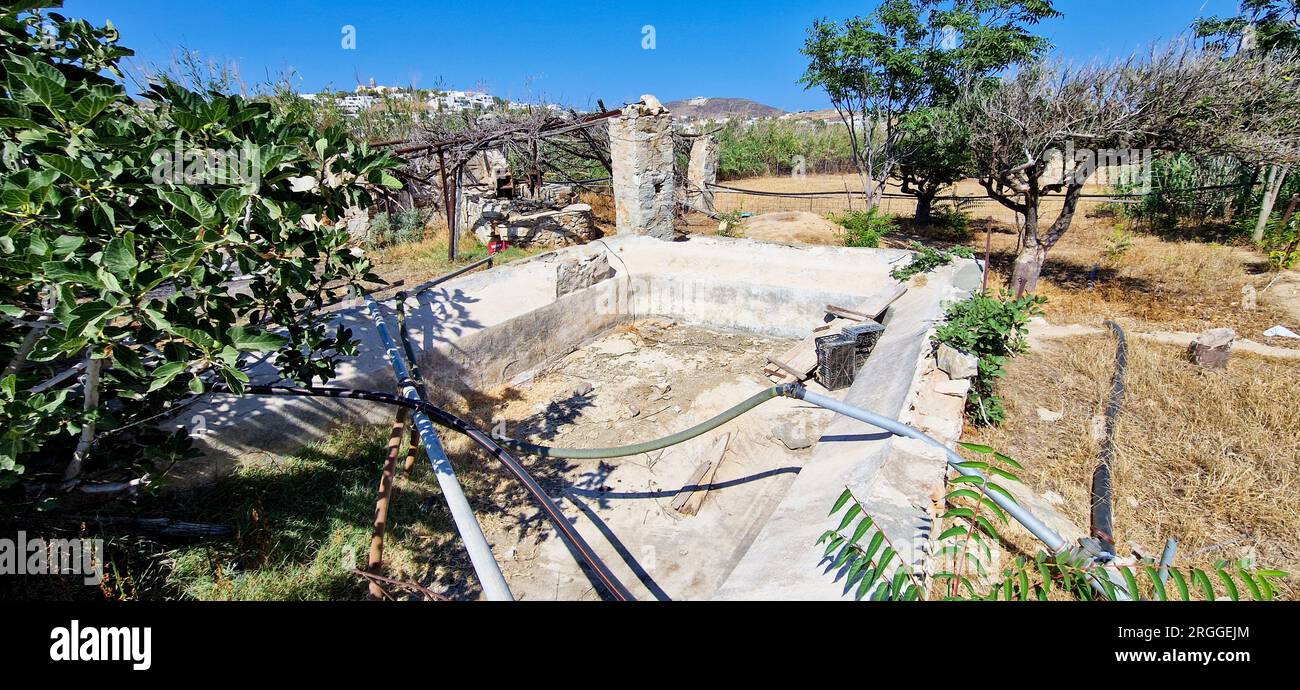 Water management, empty rain water reservoir, Syros island, Greece ...