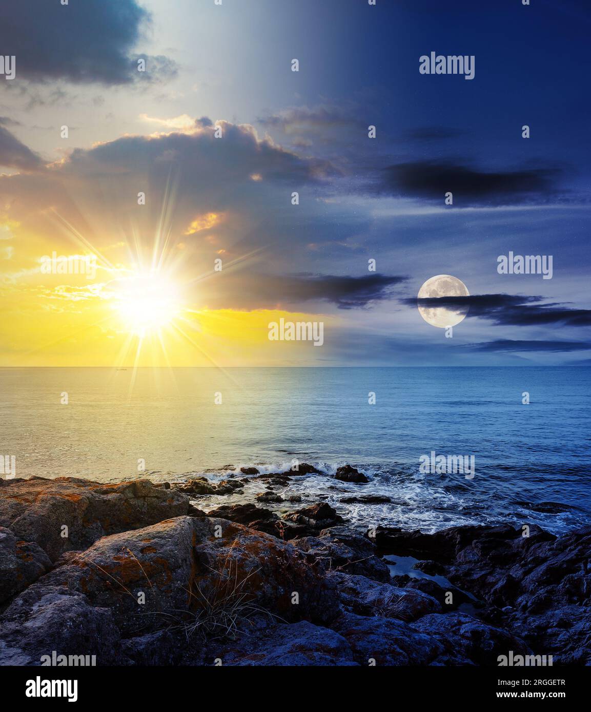 sea wave attacks the boulders of rocky shore with sun and moon at ...
