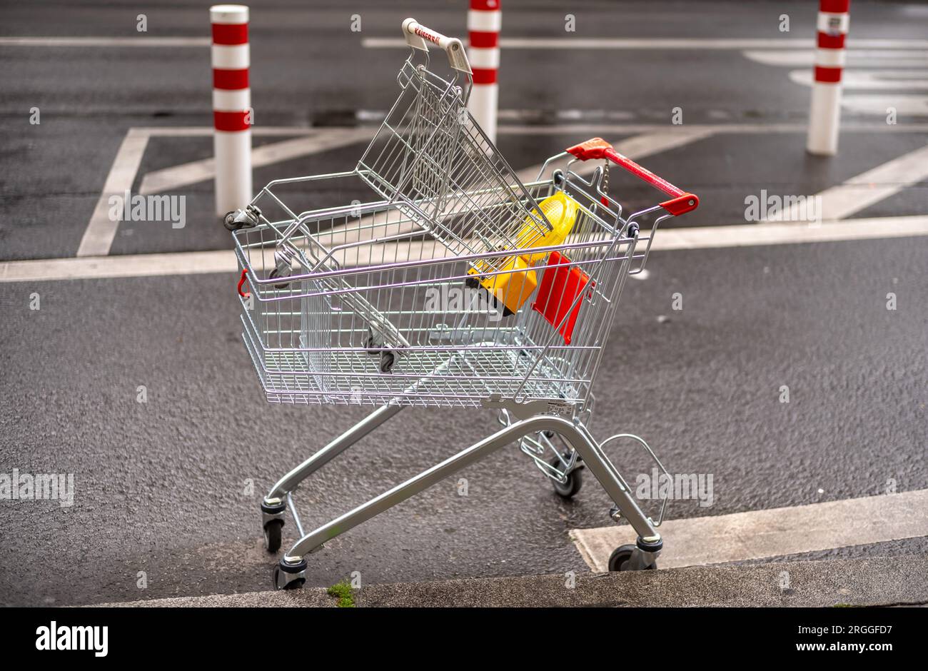 Berlin, Germany. 07th Aug, 2023. A child's shopping cart and a normal ...