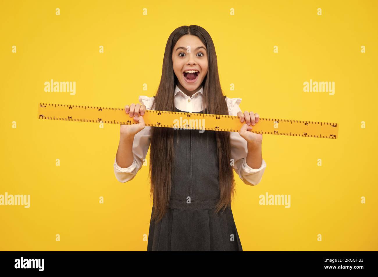 Teenager child school girl holding measure for geometry lesson ...