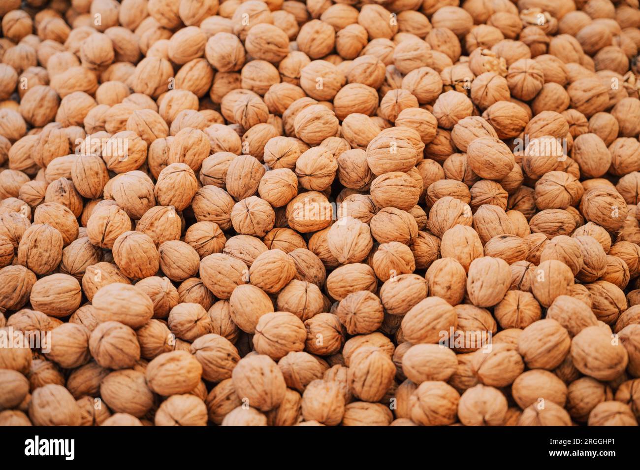 Walnut sale in the traditional farm Turkish market, a counter filled ...