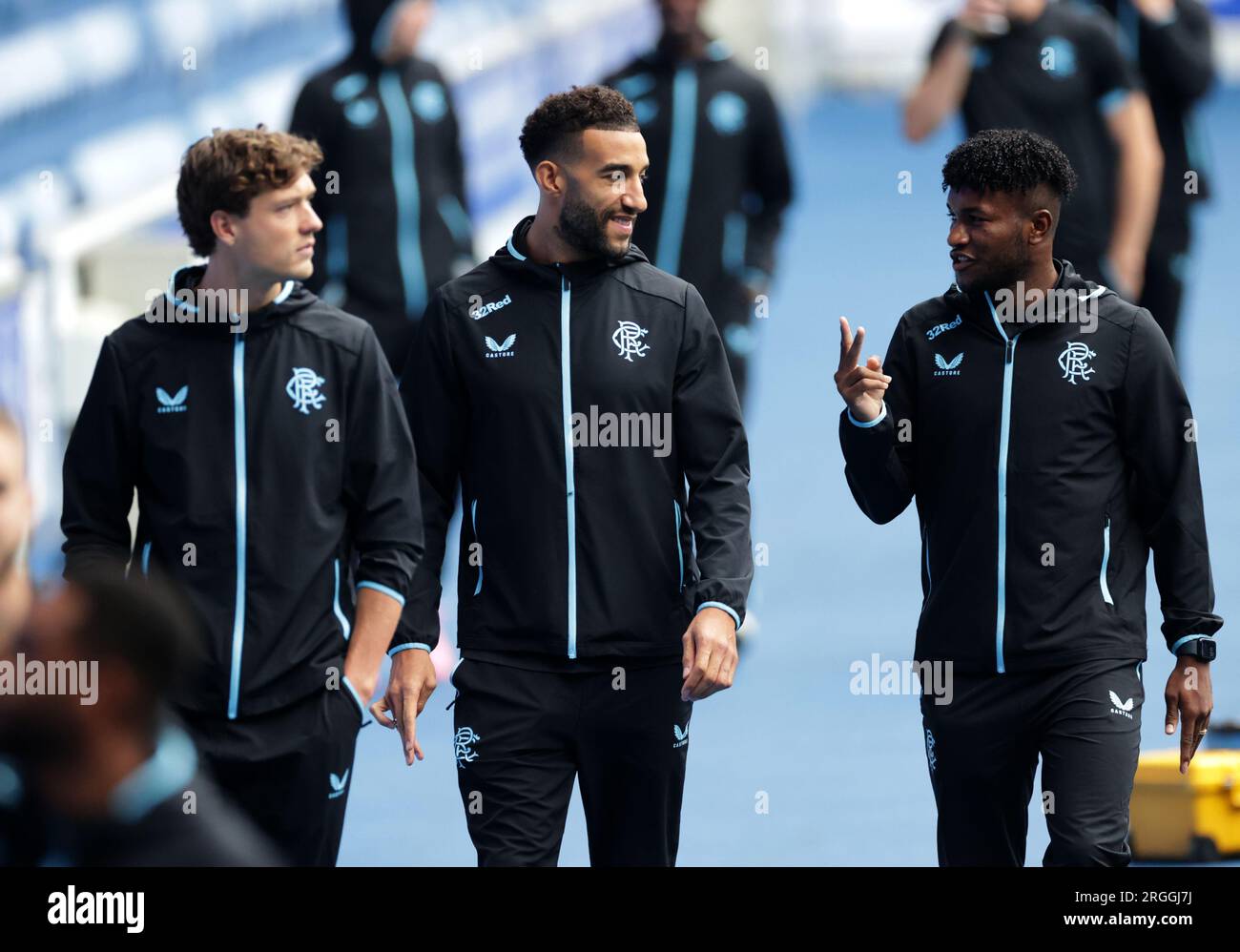 Rangers' Connor Goldson (centre) speaks to team-mates as he arrives ...