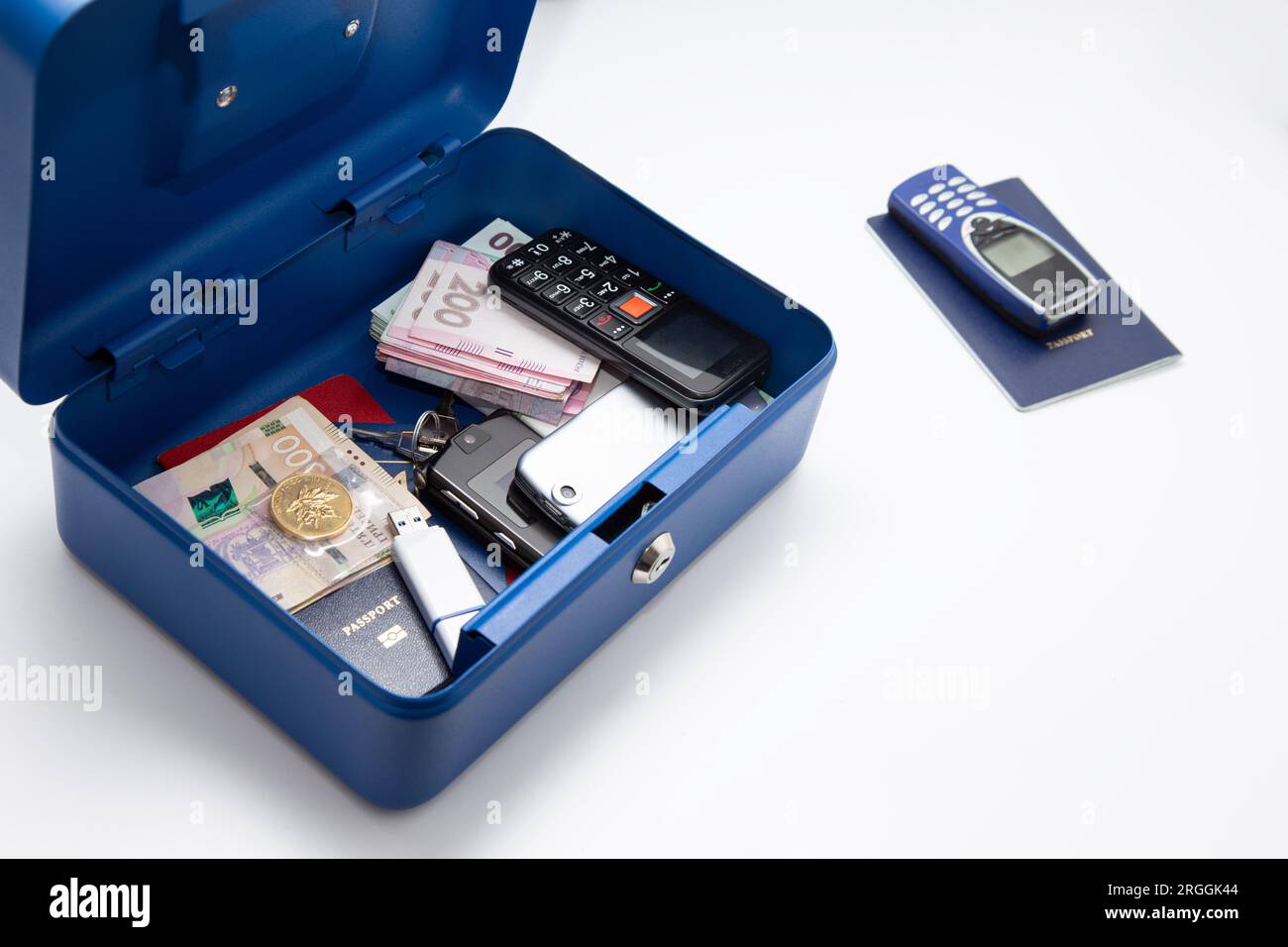 Safe box with Cash in Various currency banknotes and gold coin with ...