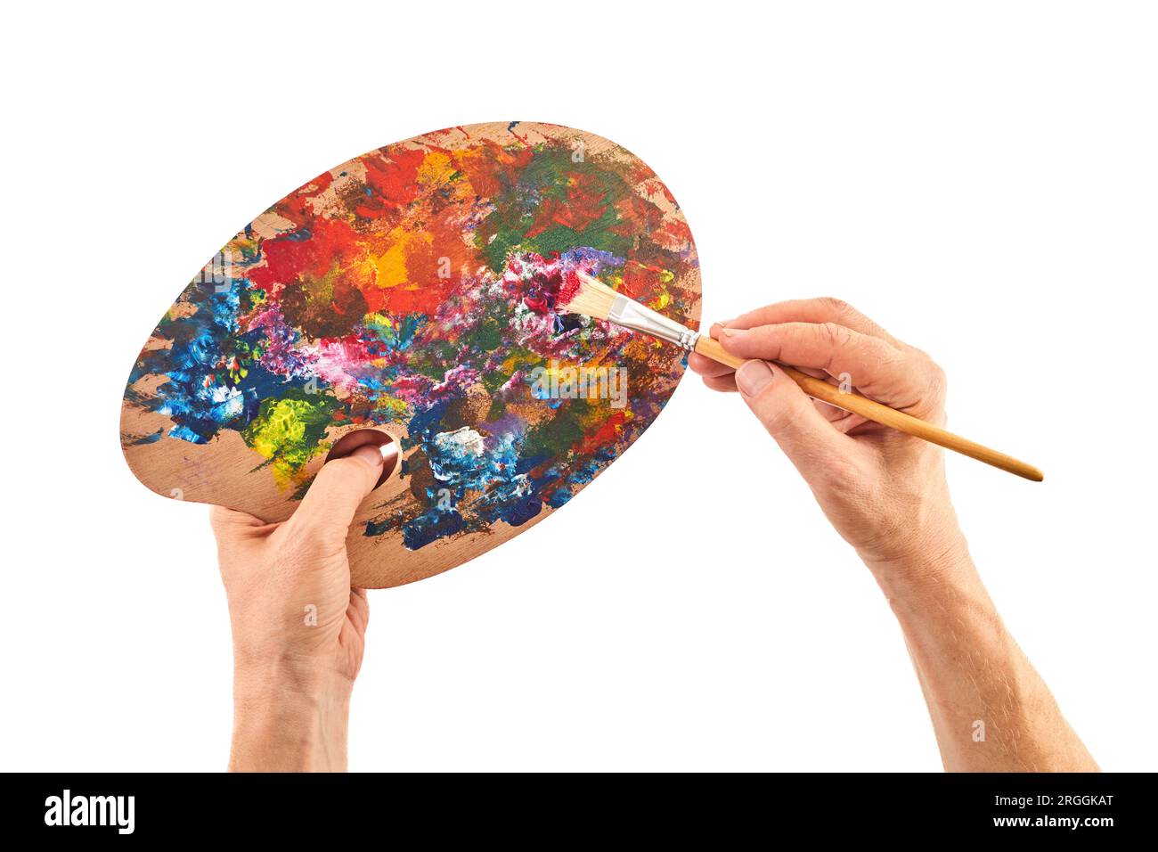 Hands with wooden art palette and brush isolated on white background ...