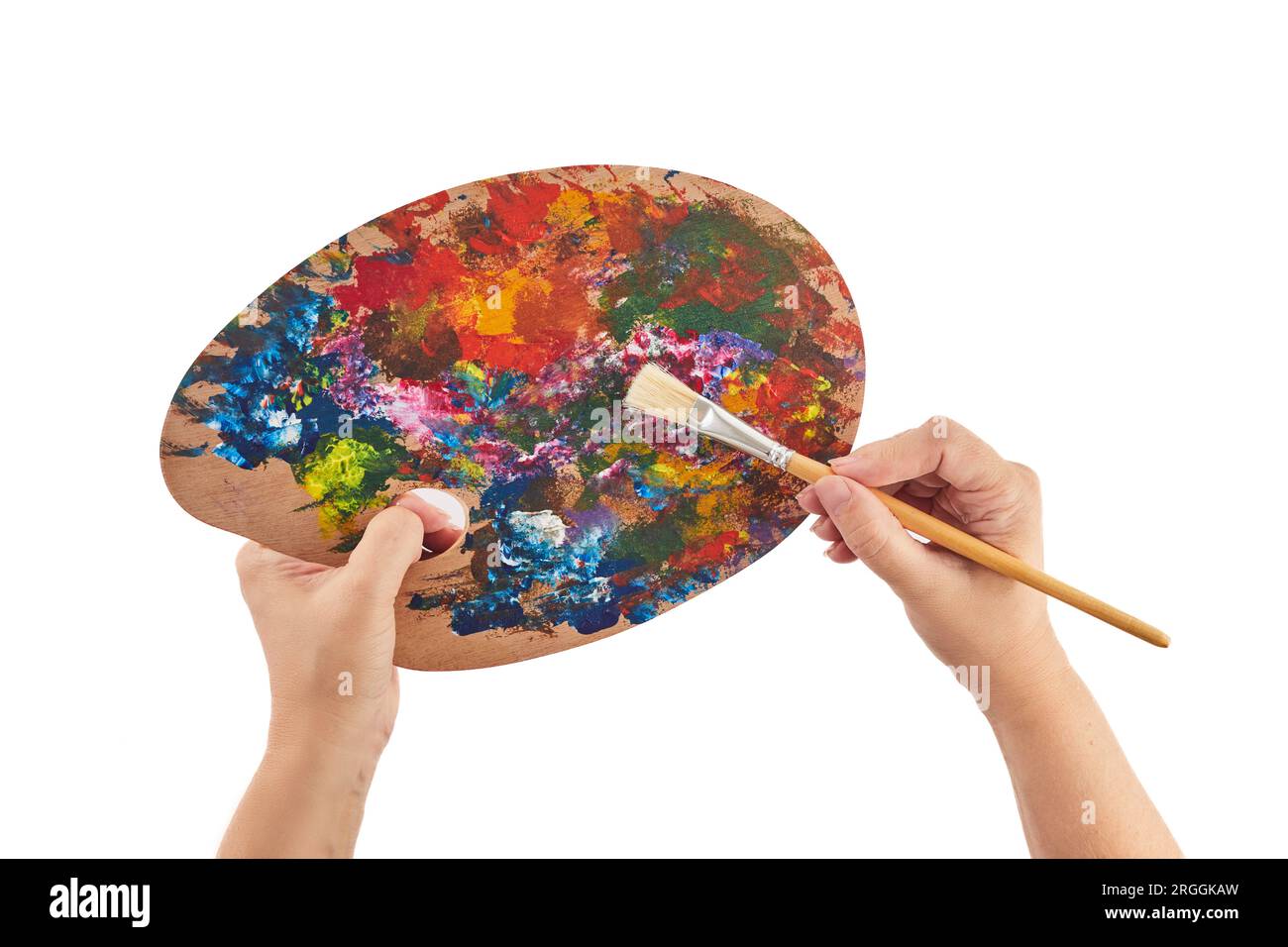 Hands with wooden art palette and brush isolated on white background ...