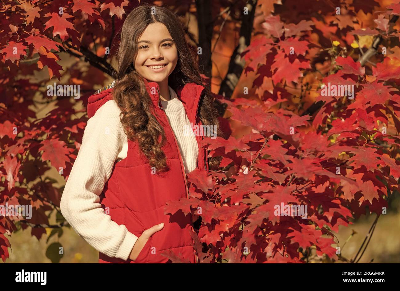 natural beauty. fall season fashion. teen girl with curly hair among ...