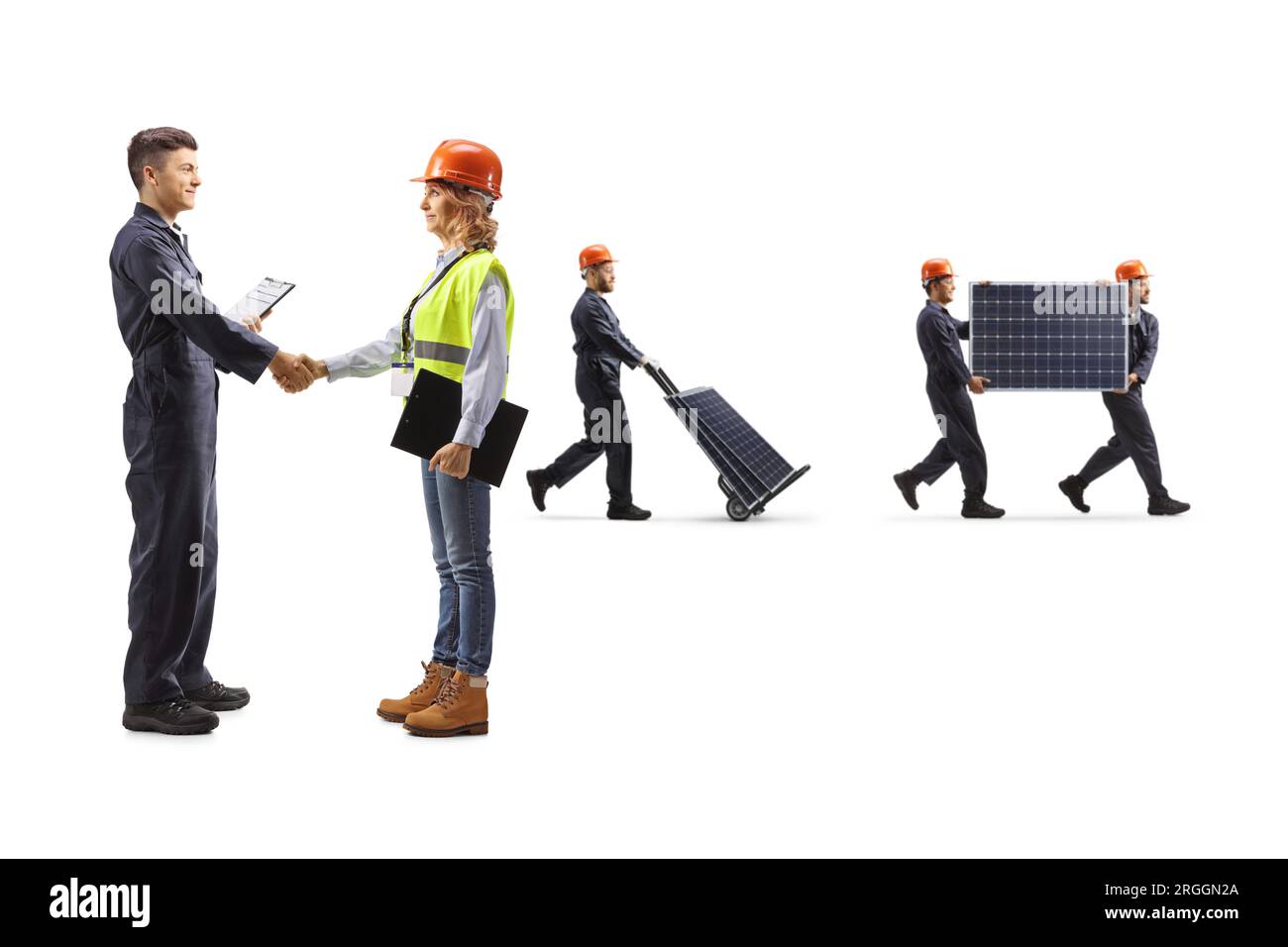 Female engineer shaking hands with a worker and other workers carrying ...