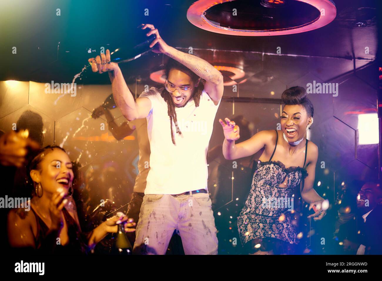 Woman spraying champagne hi-res stock photography and images - Alamy