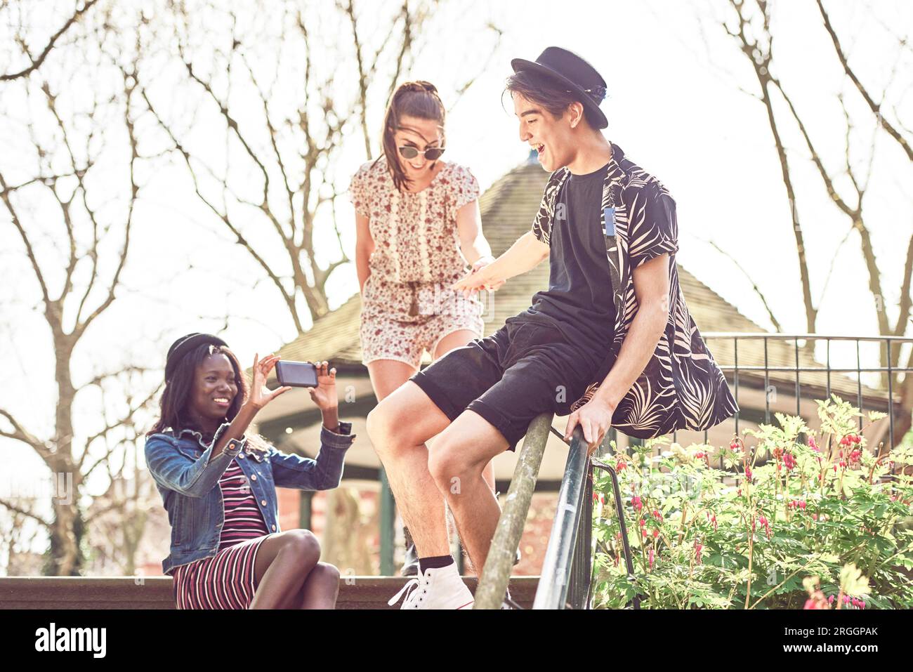 Teenage friends having fun at park Stock Photo - Alamy