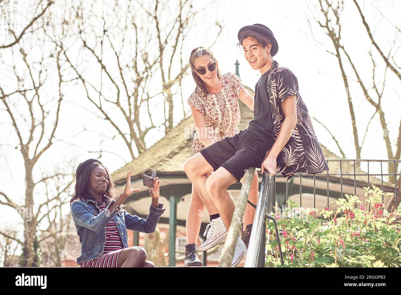 Teenage friends having fun at park Stock Photo - Alamy