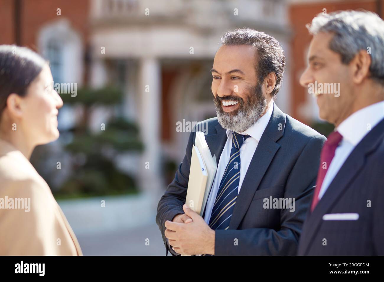 Business colleagues talking Stock Photo - Alamy